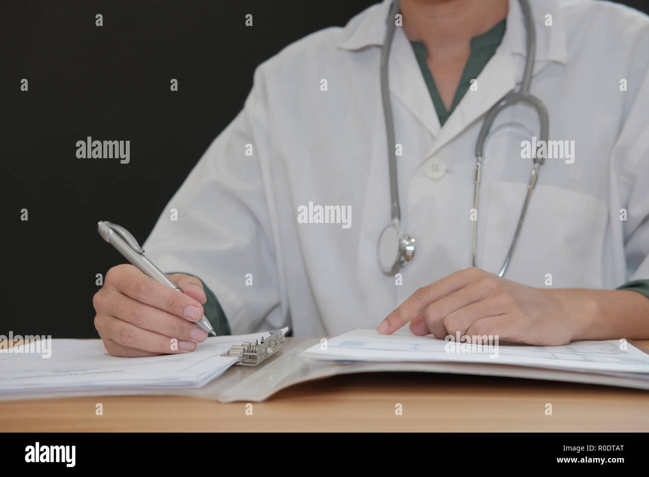 Physician writing hi-res stock photography and images - Alamy