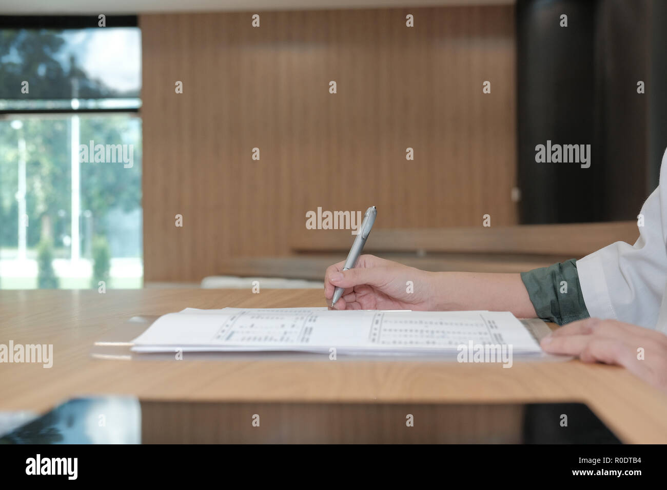doctor physician writing medical examination or prescription note at ...