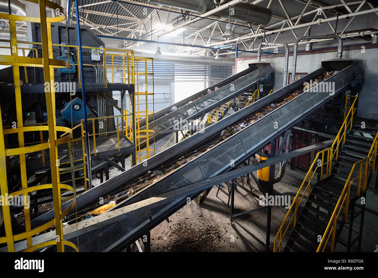 Conveyor with garbage at modern recycling plant transporting waste from ...