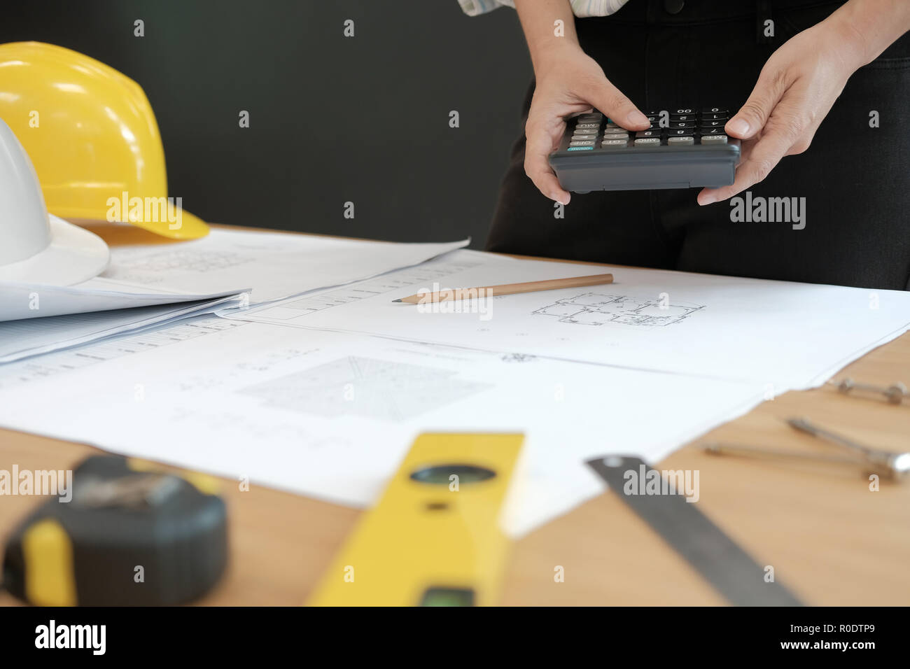 architect working on house blueprint of real estate project at ...