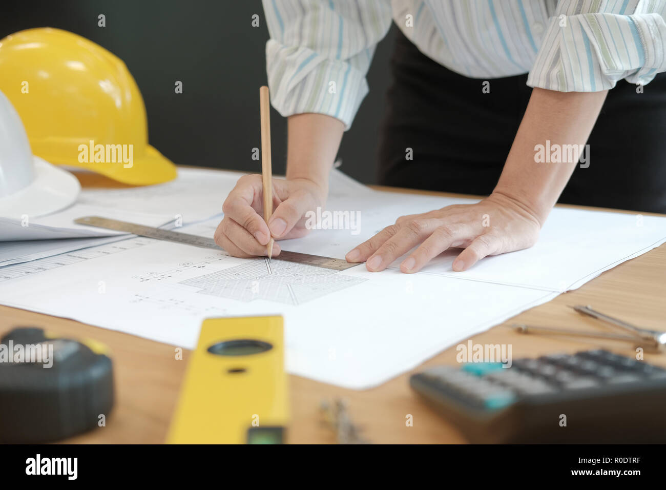architect engineer working on house blueprint of real estate project at ...