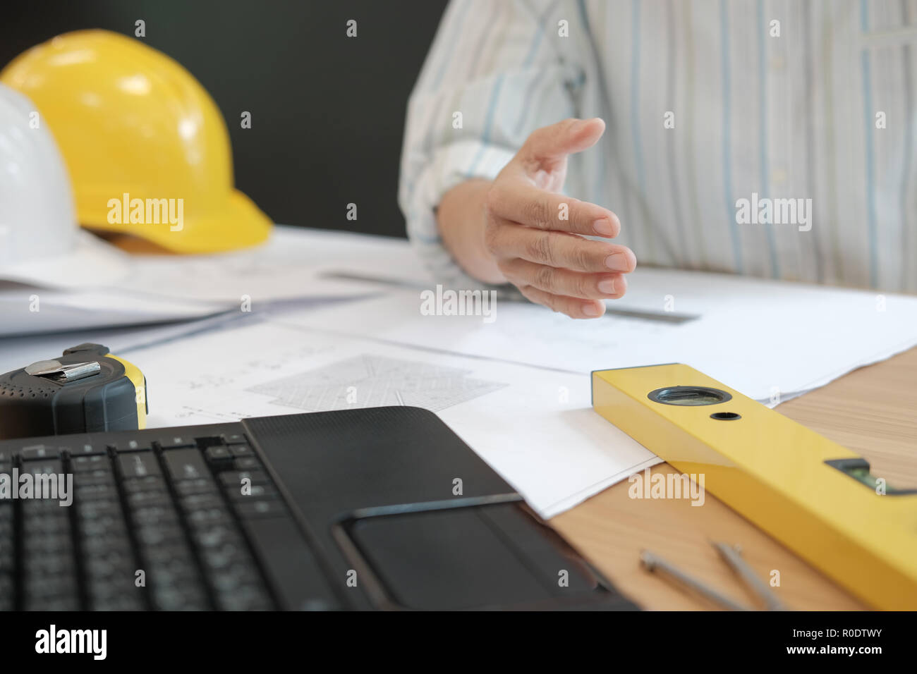 engineer offering handshake. architect ready to shake hand for building ...