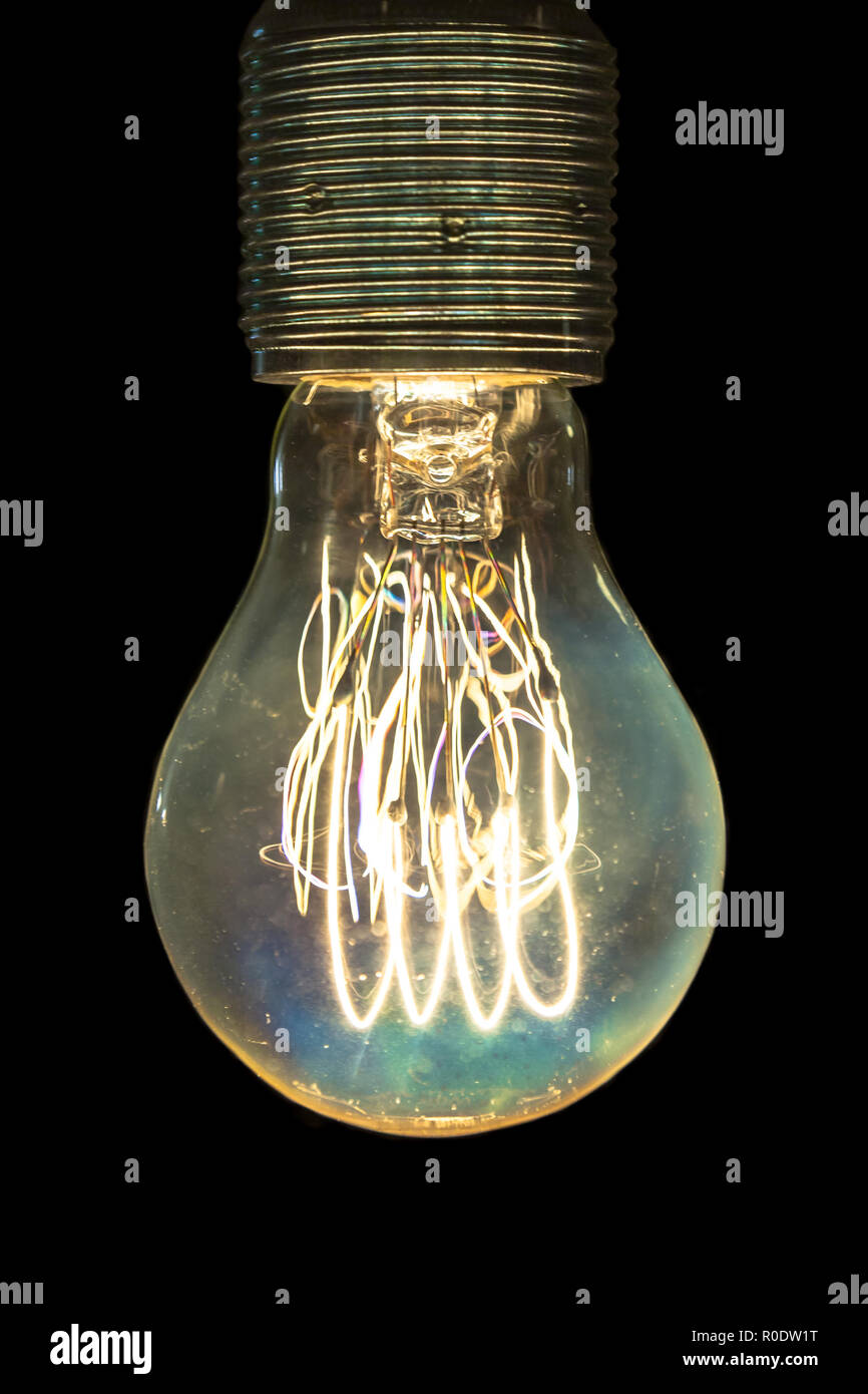 Vintage electric white light bulb glowing in the dark Stock Photo - Alamy