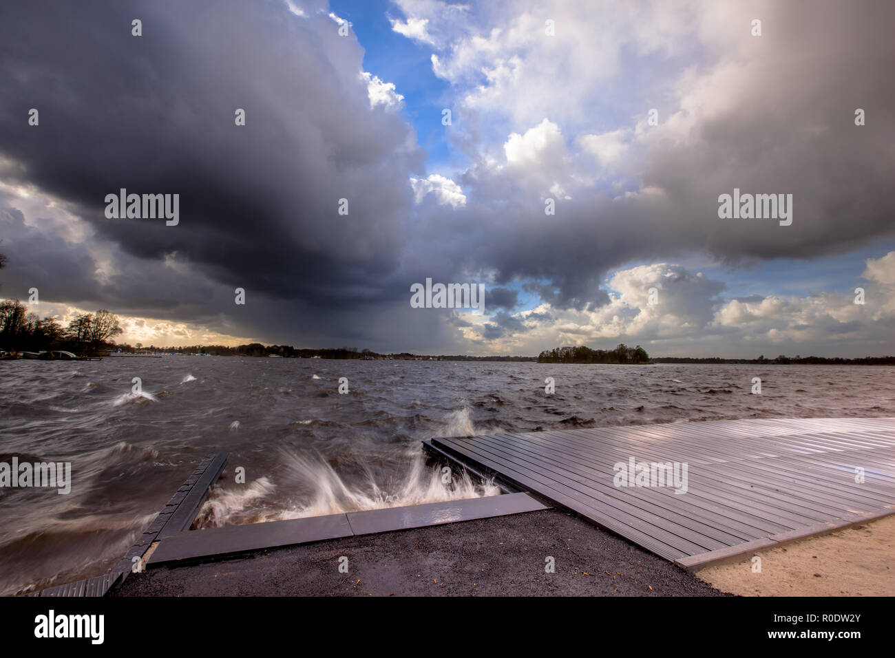 Harsh wind dark clouds and moderate high waves breaking on a landing ...