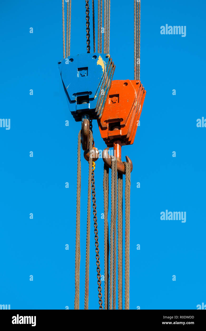 Blue and Red Crane Hook with Steel Cables Stock Photo - Alamy