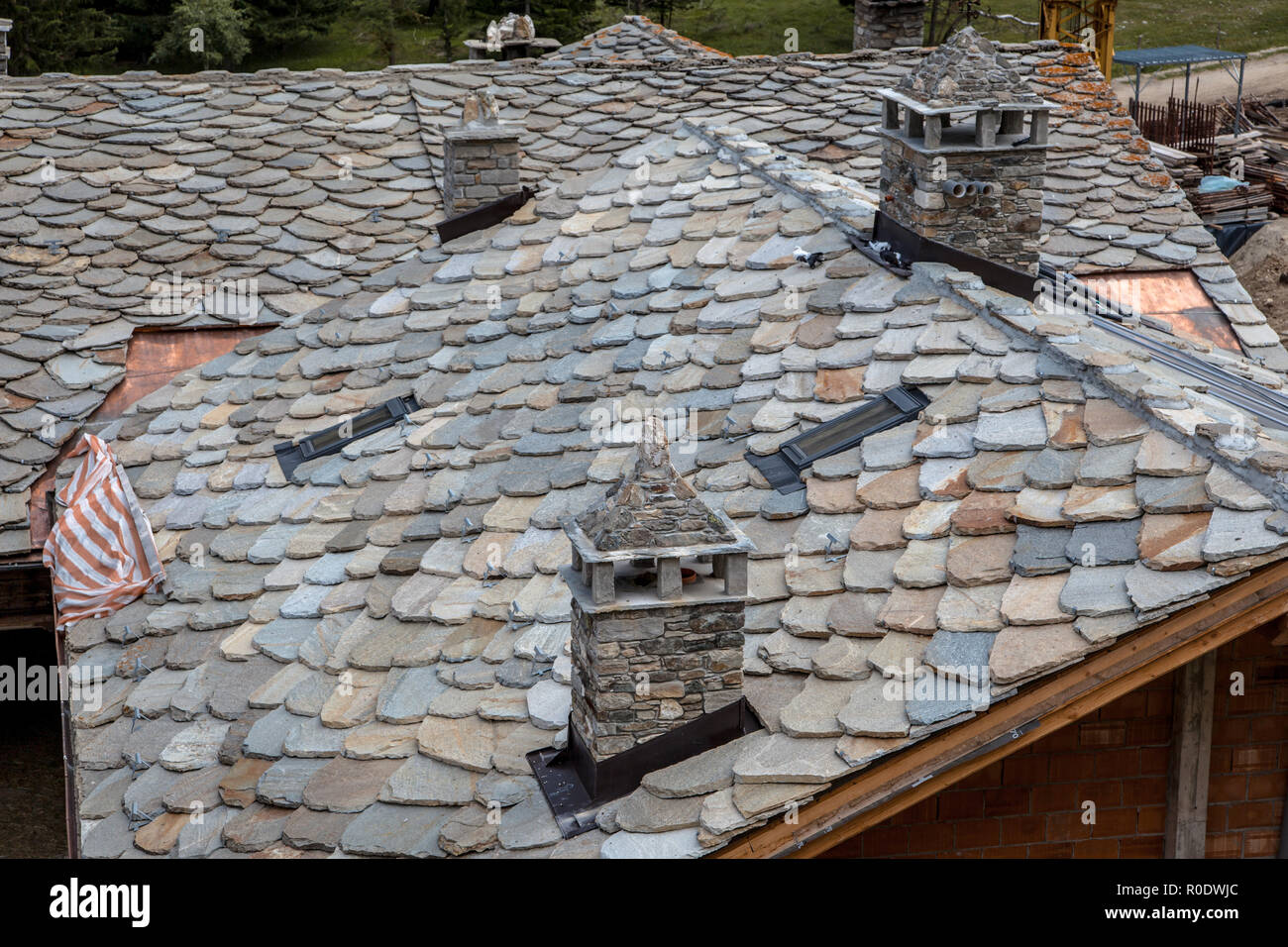 Schist Roof Tiles Being Installed on a New House Stock Photo - Alamy