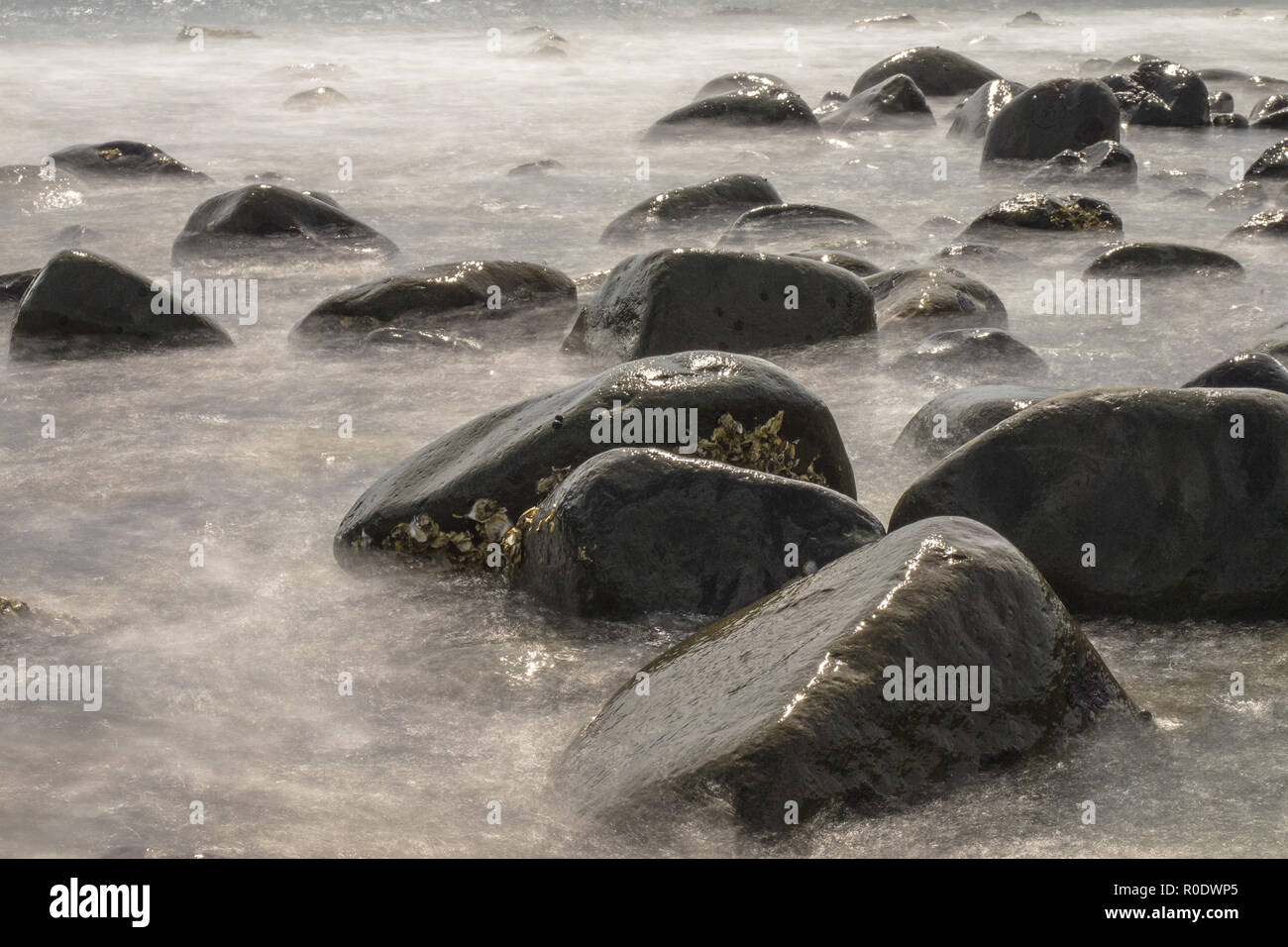 Long Exposure Image of Rocks in the Sea Stock Photo - Alamy