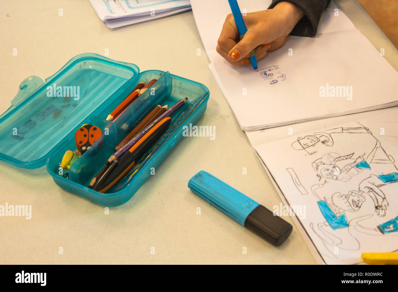 Student Writing in Notebook during Lesson on School Stock Photo - Alamy