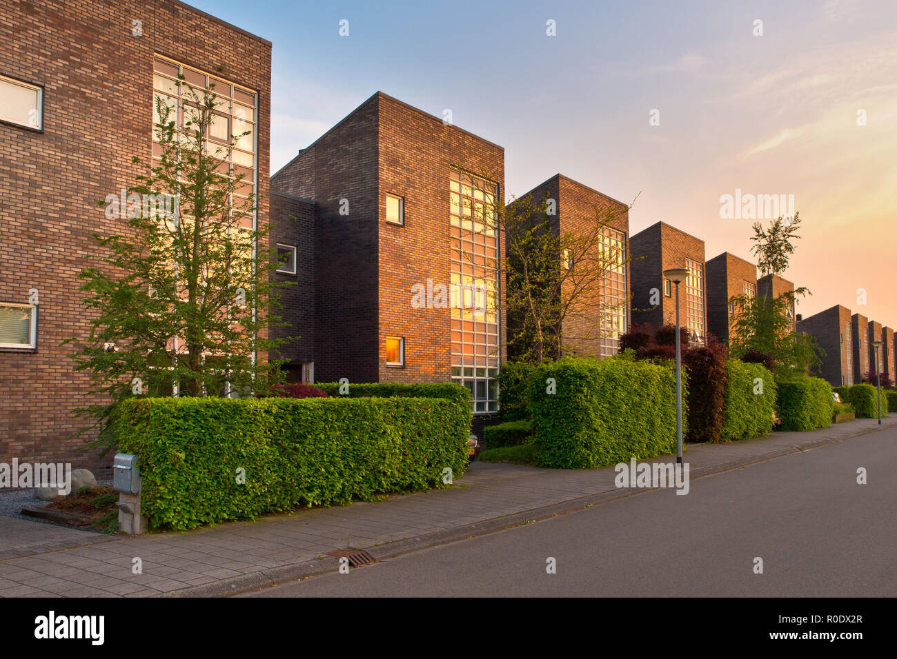 Street with modern houses in a suburban area Stock Photo - Alamy