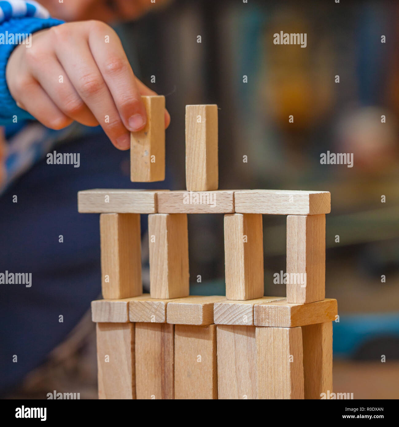 Boy Building a Structure from Wooden Building Blocks Stock Photo - Alamy