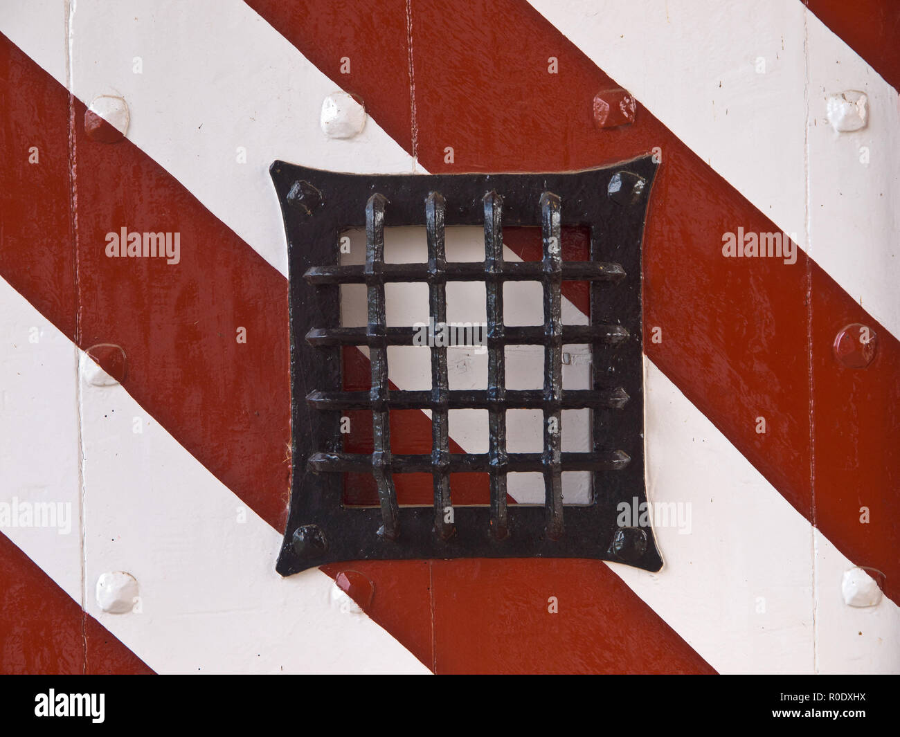 Grating on a Red with White Striped Door of a Medieval Castle in Europe ...