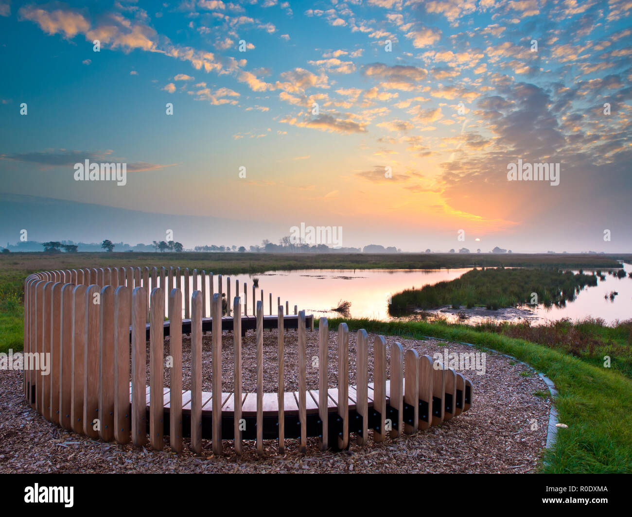 Wooden Lookout Bench overseeing Sunset over a Swamp Nature Reserve ...