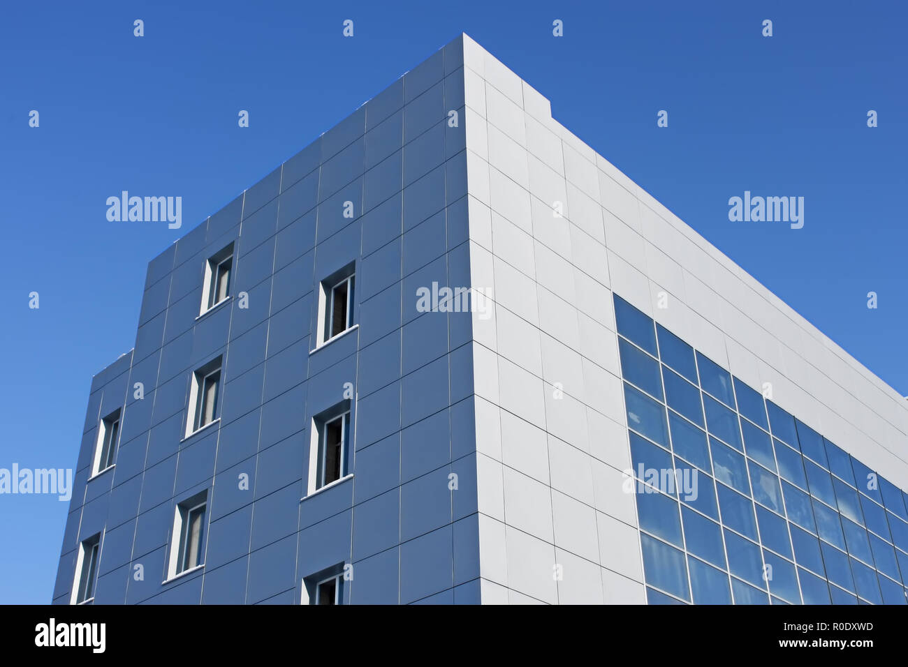 Upper part of the modern office building. Winter snapshot - remnants of ...