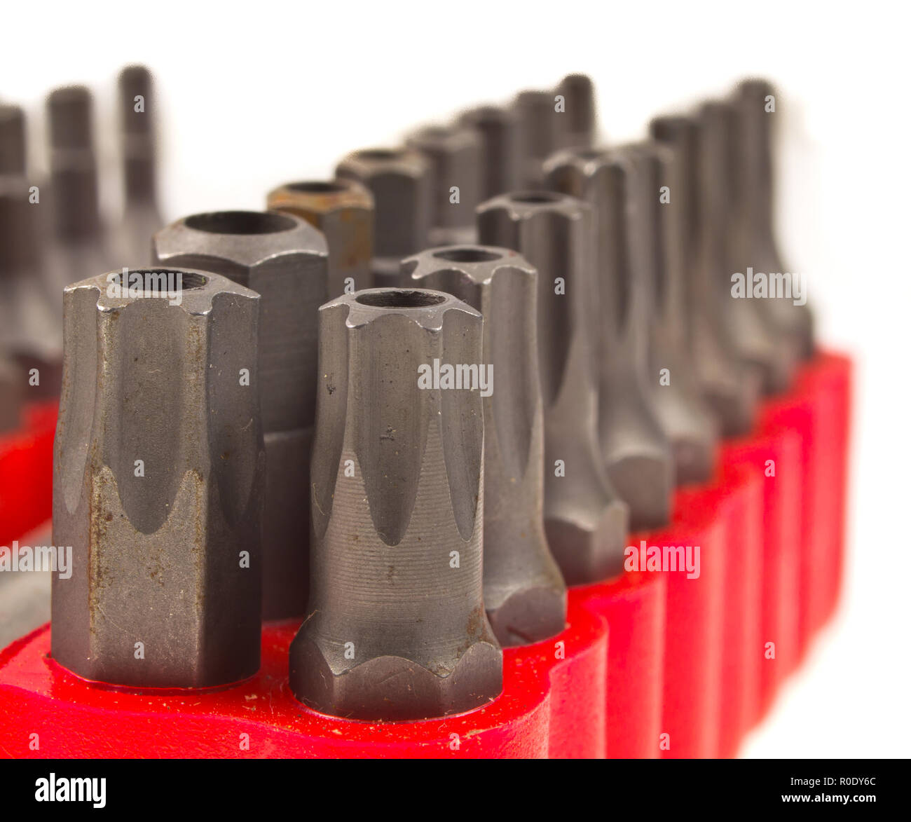 set of bit heads for screwdriver in red box isolated on white ...