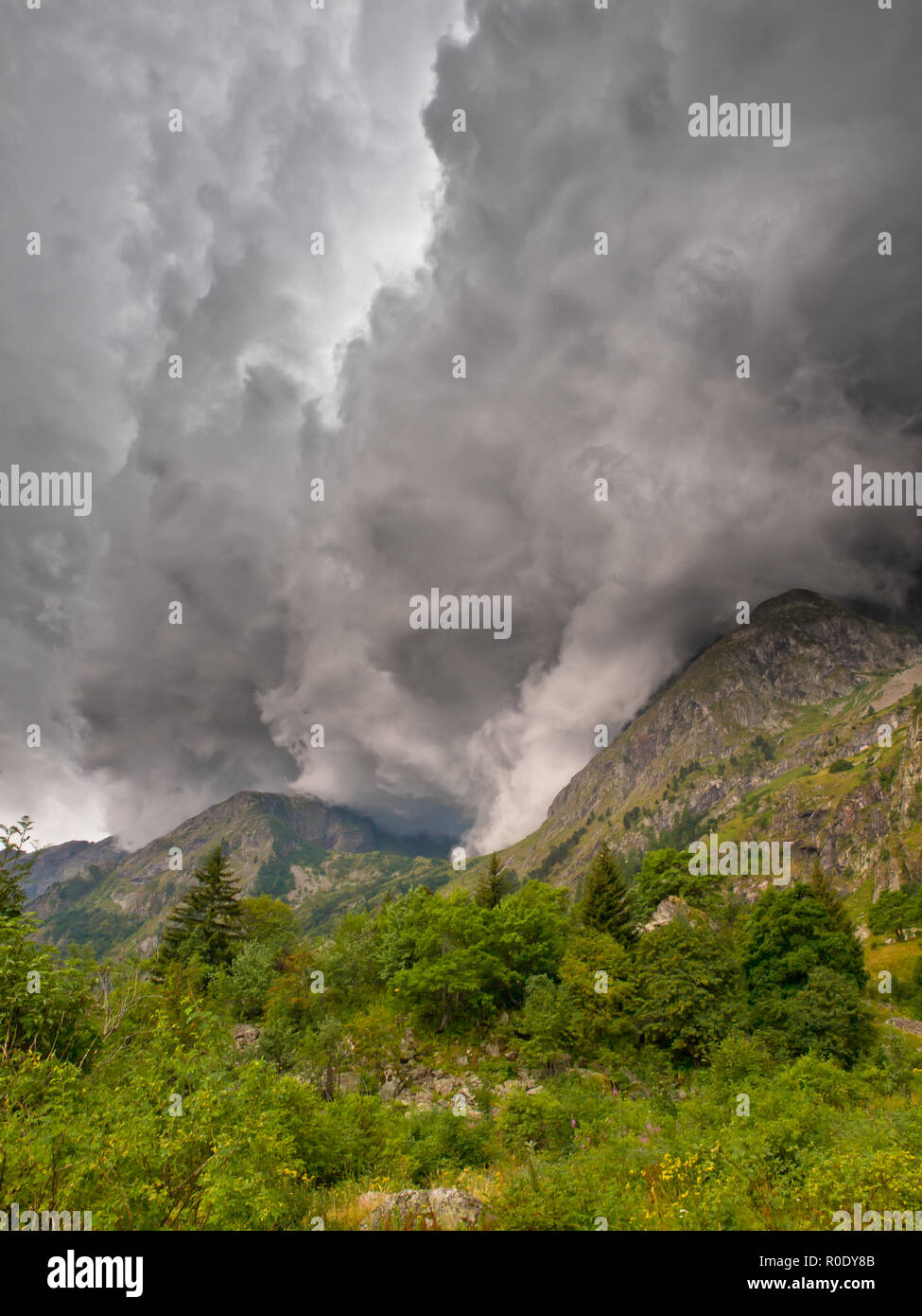 Dark Storm Clouds are Rolling in Over a Mountain Top Stock Photo - Alamy