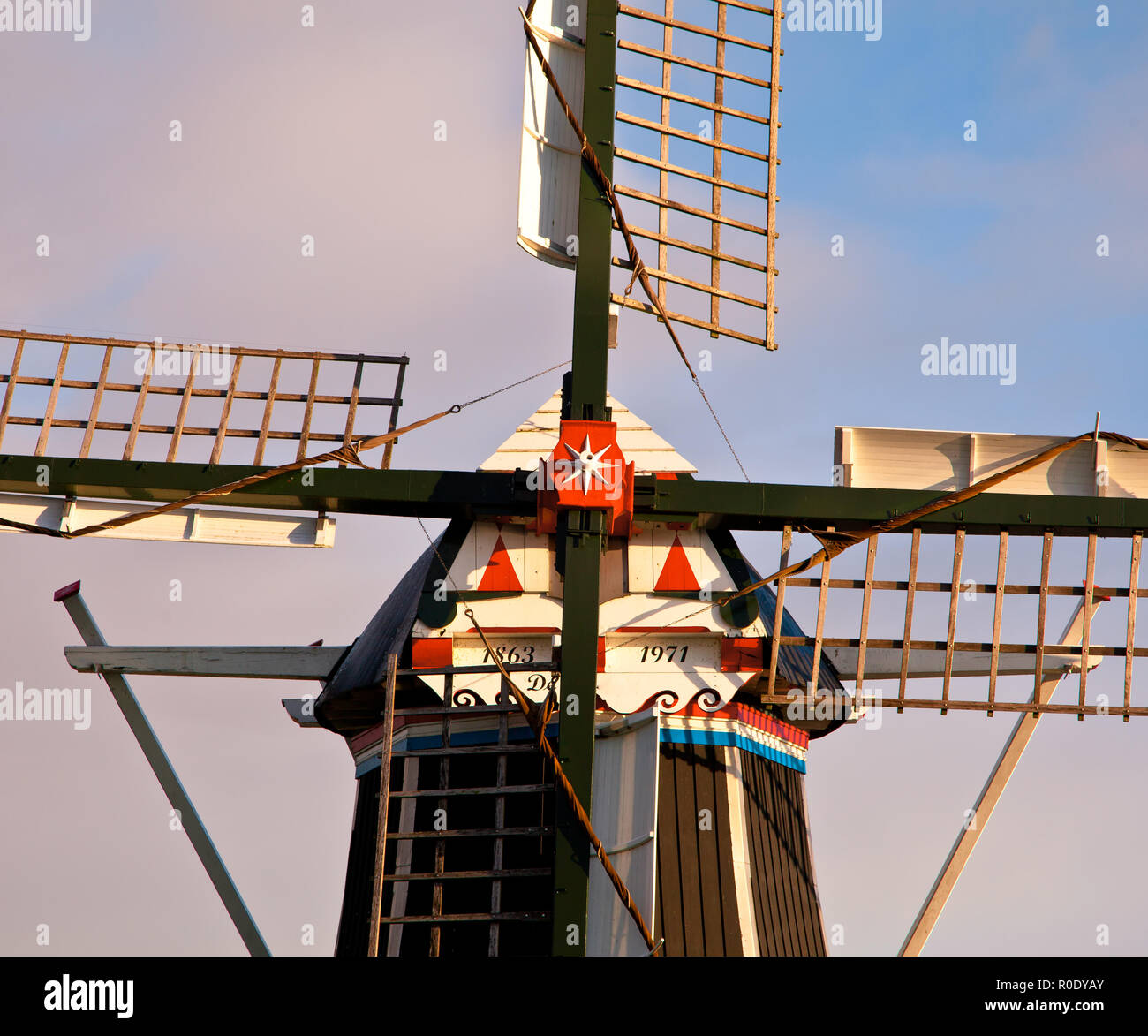 Dutch Windmill on the Waterfront of a Lake with Spectacular Clouds ...