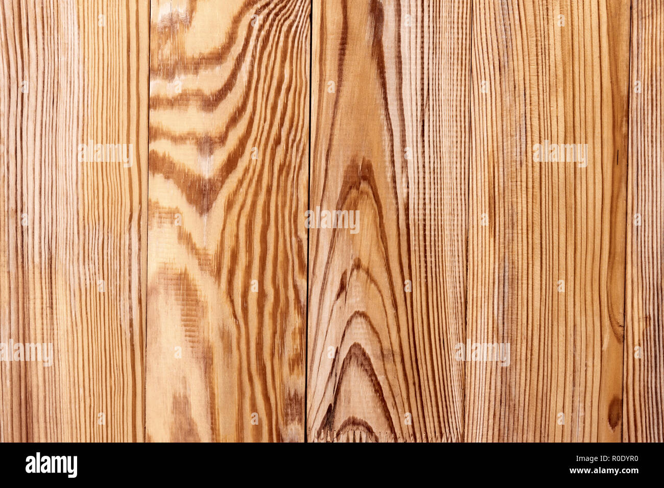 Wooden shield with vertical parallel boards have contrasting annual ...