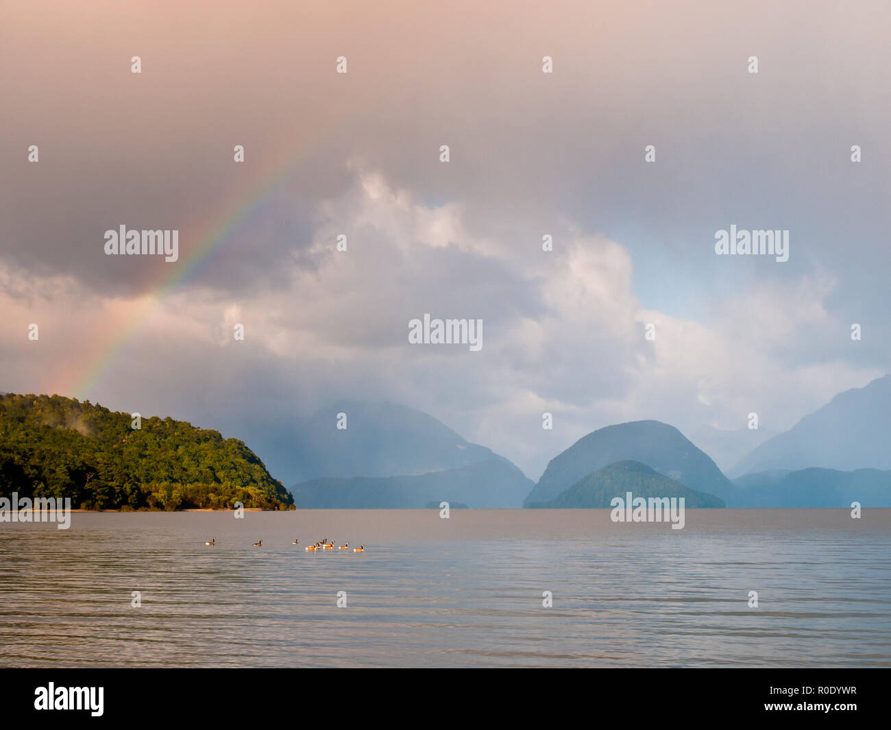Rainbow above Manapouri lake along the Kepler track Stock Photo - Alamy