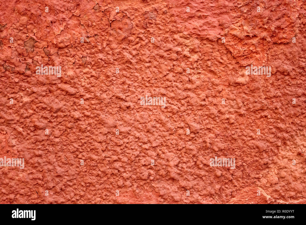 Detail of old red wall with shelled stucco Stock Photo - Alamy