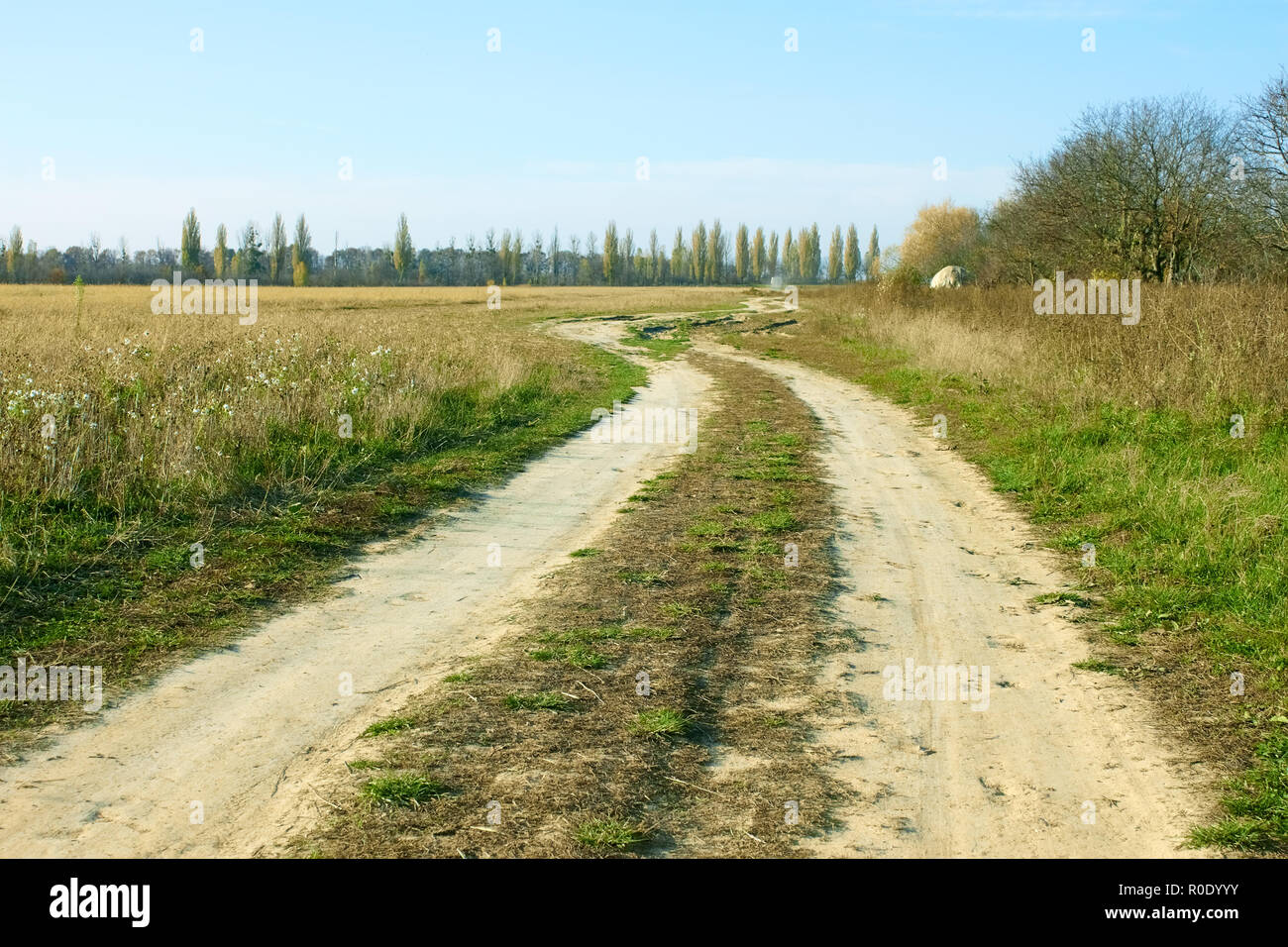 Rural ground road with two tracks in the lovely autumn weather Stock ...