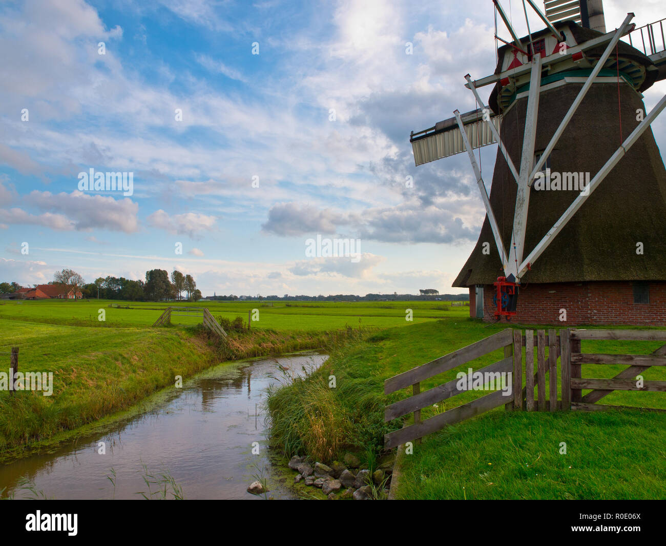 Typical dutch agricultural landscape with old vintage windmill Stock ...