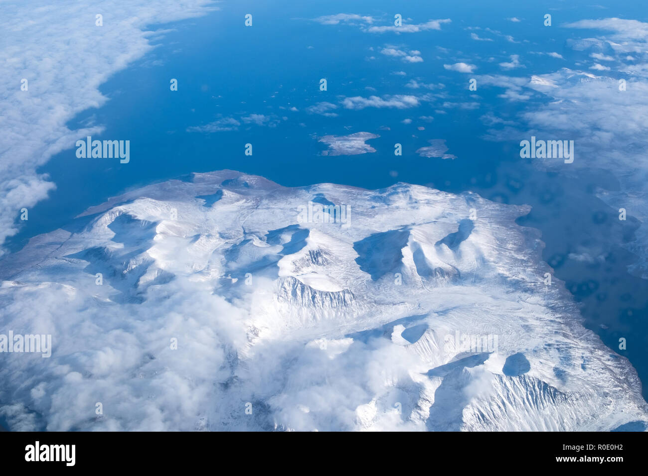 Alpine scenery from the air through the airplane window Stock Photo - Alamy
