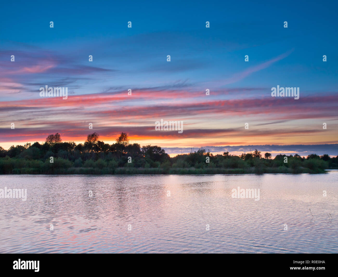 Spectacular sunset over dutch lake Stock Photo - Alamy