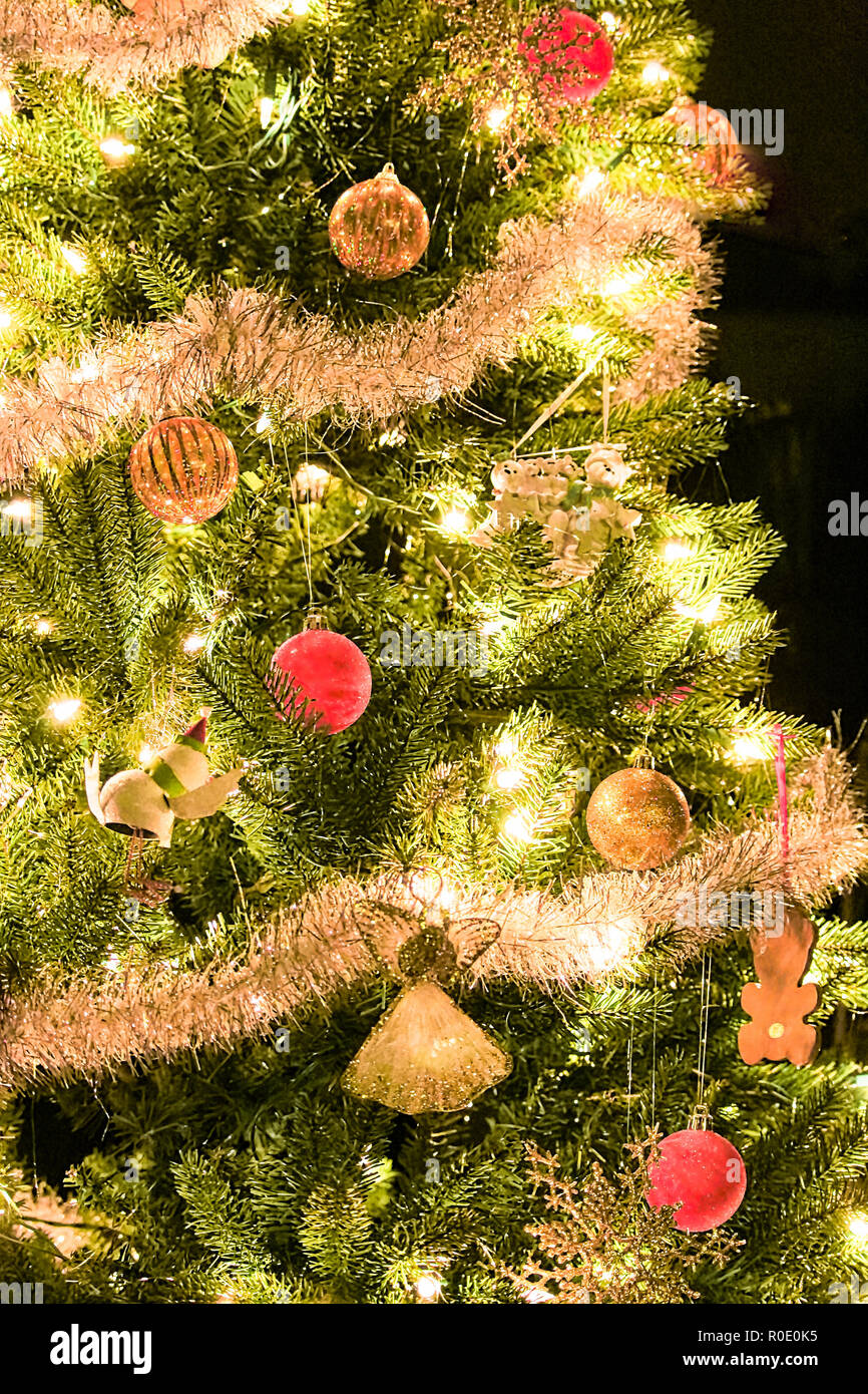 A the side of a decorated christmas tree shining in the dark Stock ...