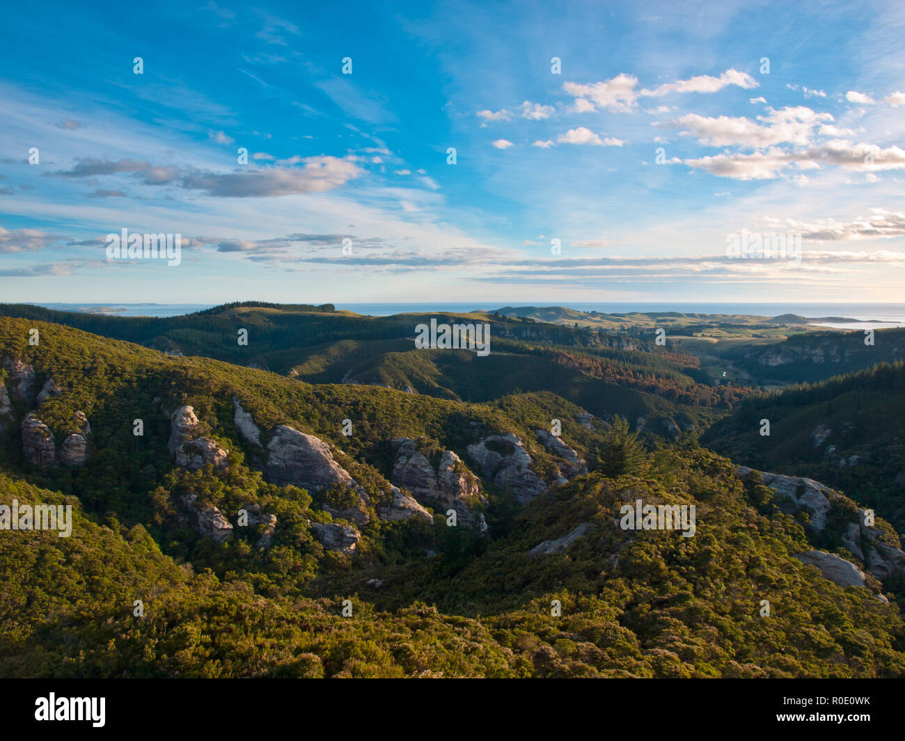 Hilly landscape during sunrise Stock Photo - Alamy