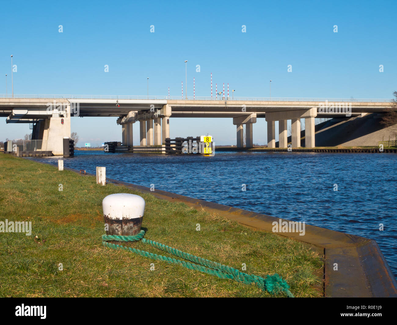 Big concrete river bridge with mooring post Stock Photo - Alamy