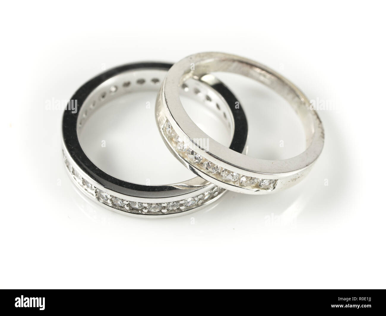 Two wedding rings on white background Stock Photo - Alamy