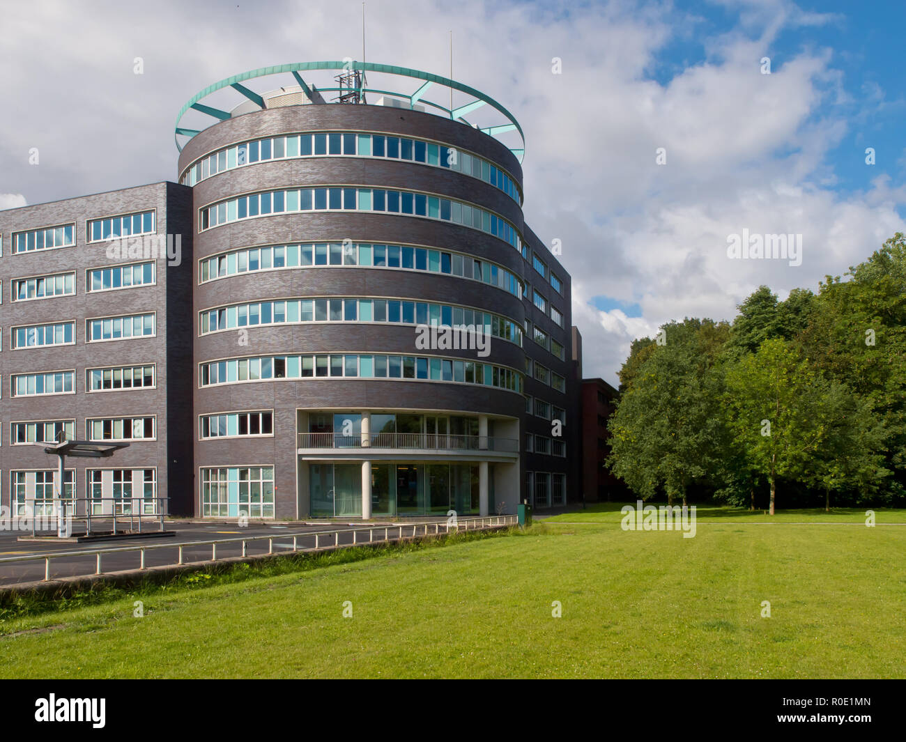 Modern low rise office looking out on forest edge Stock Photo - Alamy