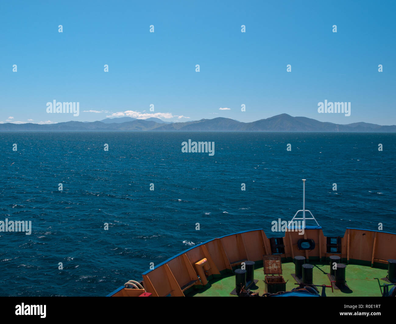 The bow of a ferry with the coast on the horizon Stock Photo - Alamy