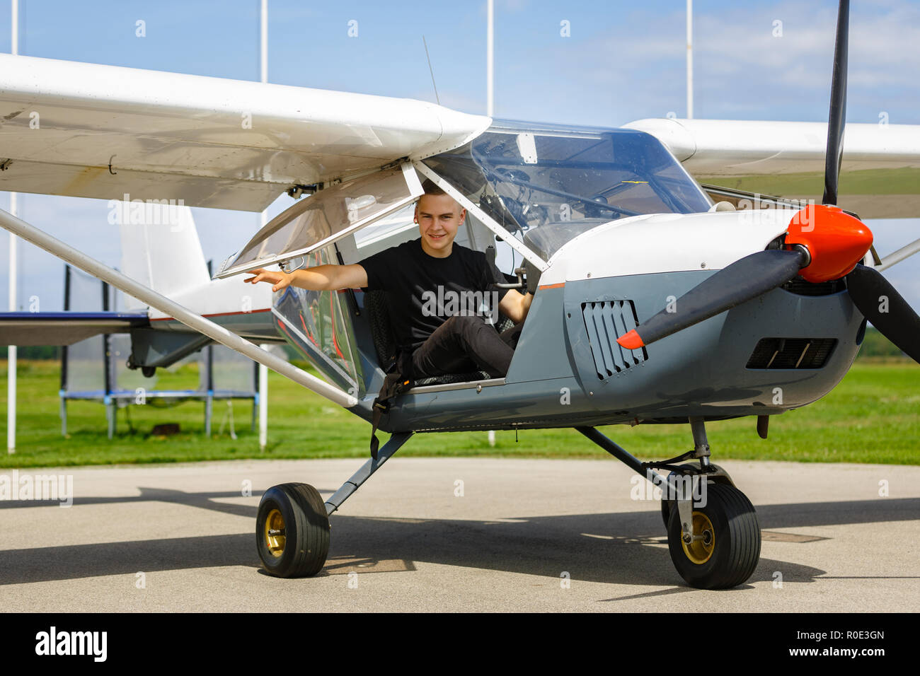 young man in small plane cockpit Stock Photo - Alamy