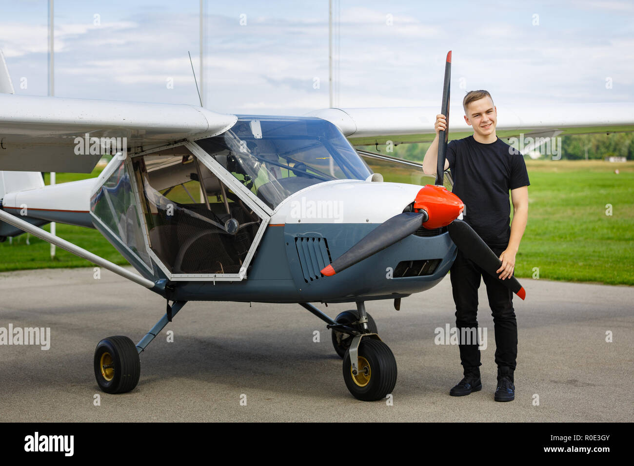 young man in small plane cockpit Stock Photo - Alamy