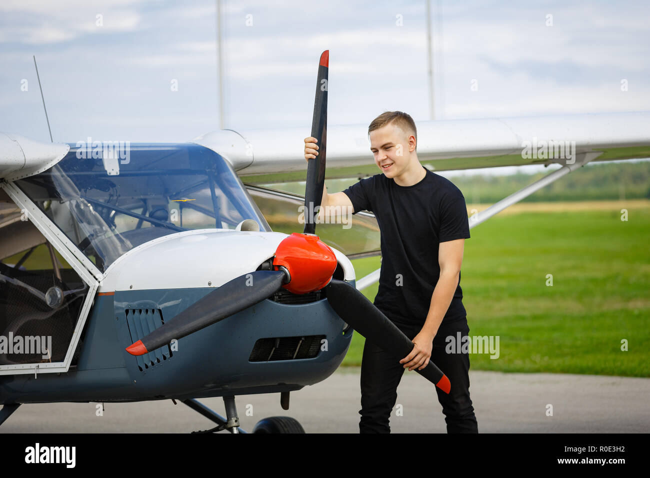 young man in small plane cockpit Stock Photo - Alamy