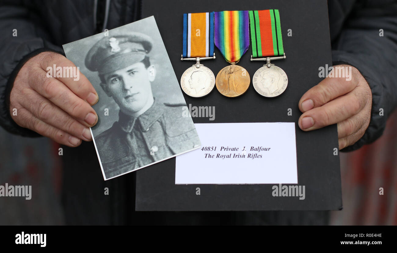 Balfour Hoey, holds the medals of his grandfather John Balfour one of ...