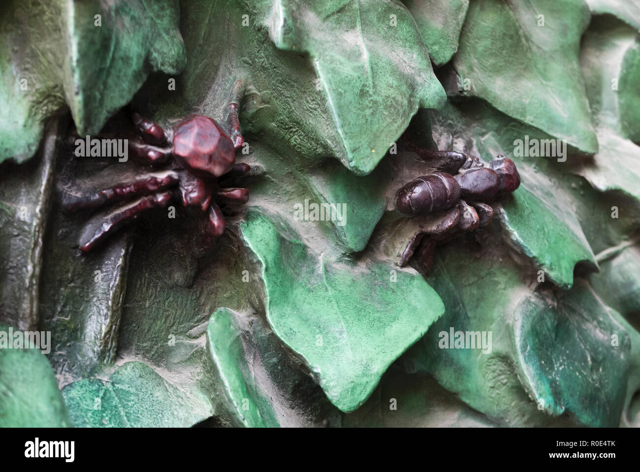 Fine detail of flowers and insects on one of the doors of the Sagrada ...