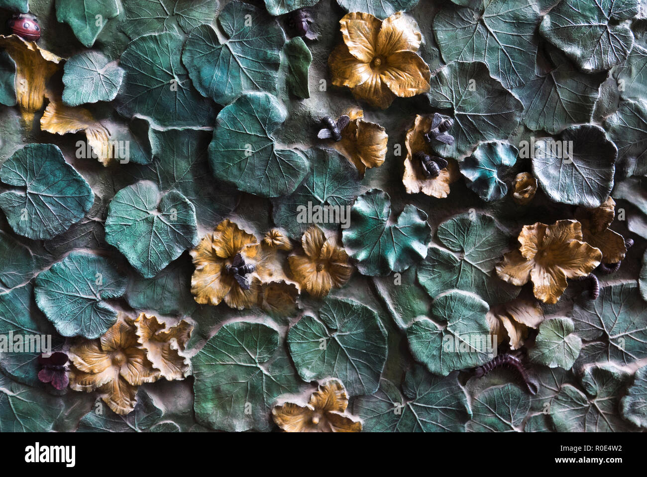 Fine detail of flowers and insects on one of the doors of the Sagrada ...