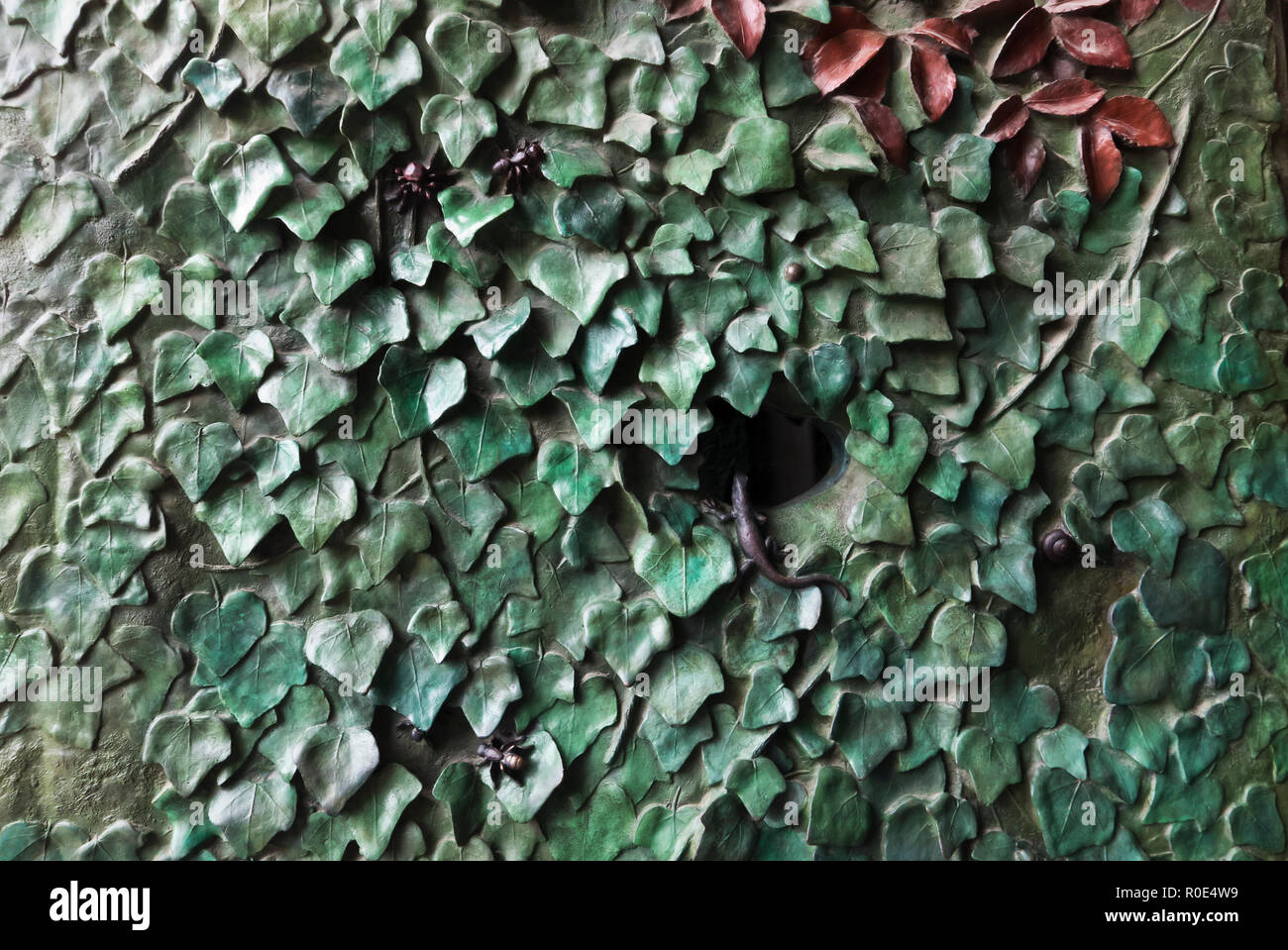 Fine detail of flowers and insects on one of the doors of the Sagrada ...