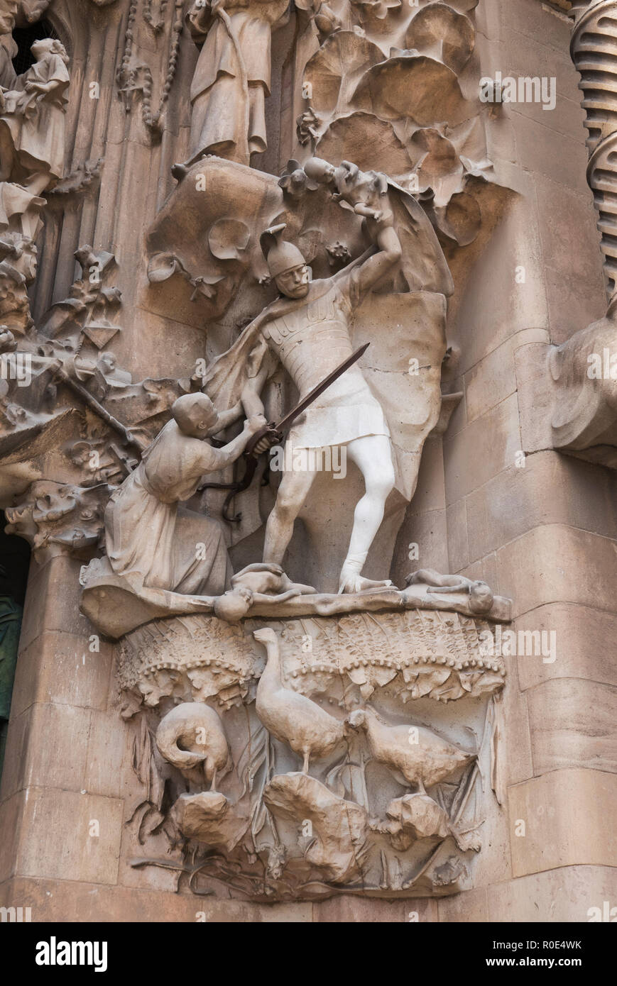 A sculpture of a Roman soldier on the exterior wall of the Sagrada ...