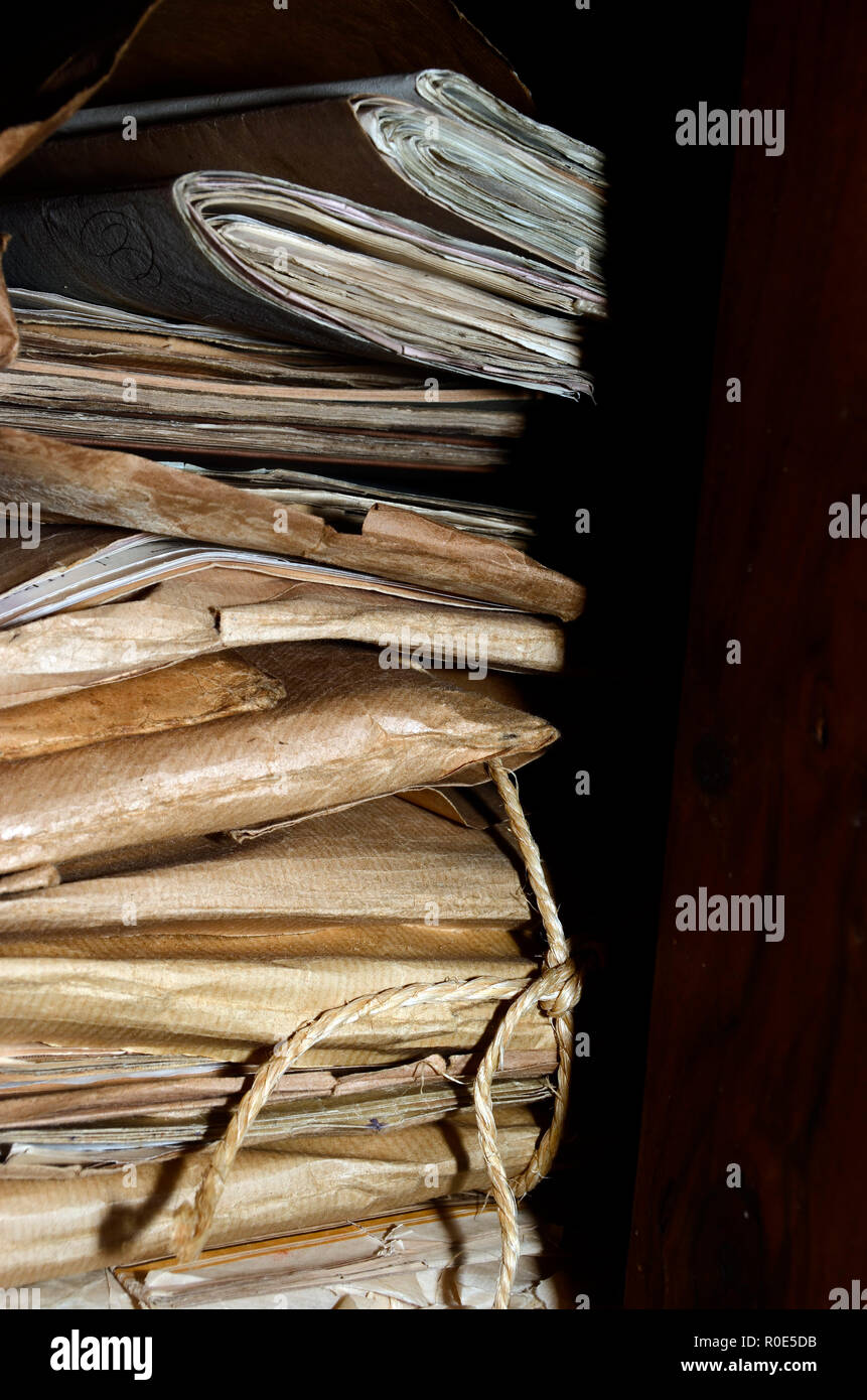 Stack of old folders and files or sheets in a cabinet, close up for ...