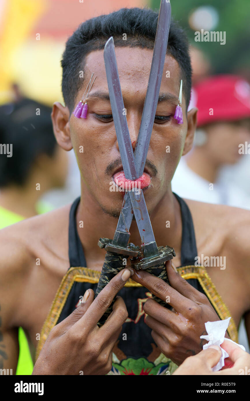 Phuket Town, THAILAND, October 06, 2016 : Devotee extreme piercing ...