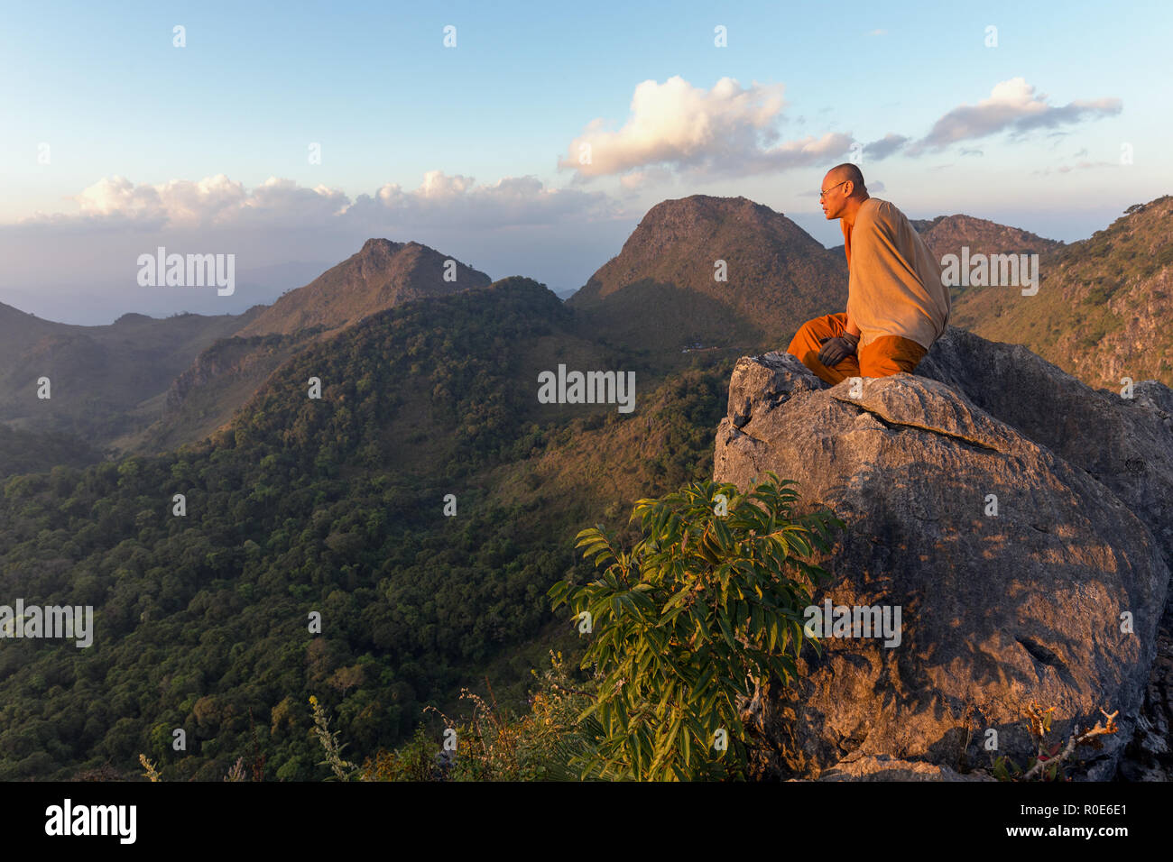 Buddhist Monk Meditating On Mountain