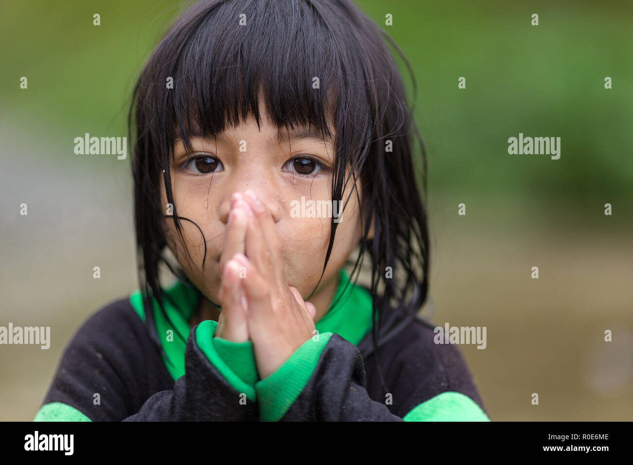 Filipino praying hi-res stock photography and images - Alamy