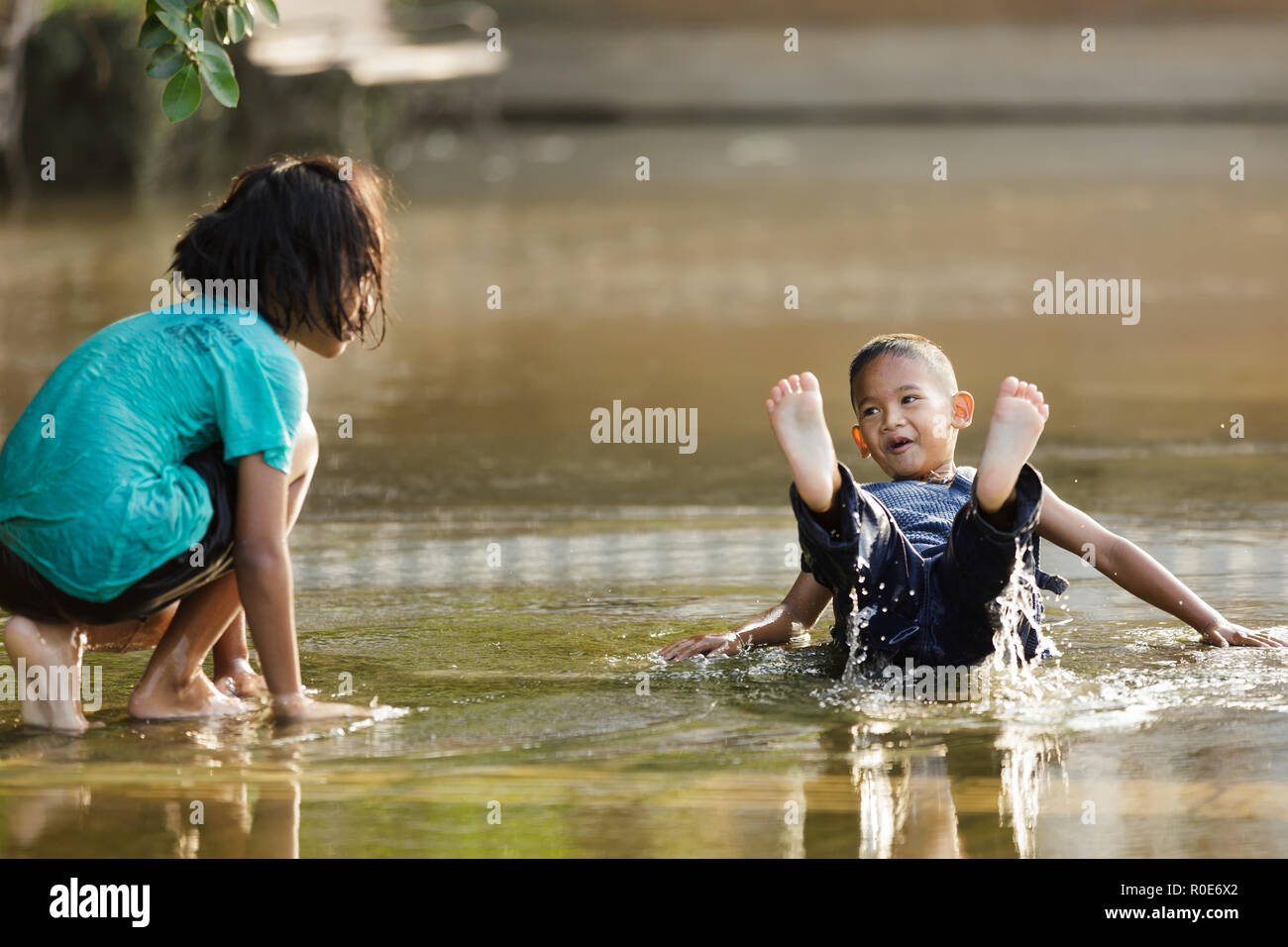 Young kids wet clothes hi-res stock photography and images - Alamy