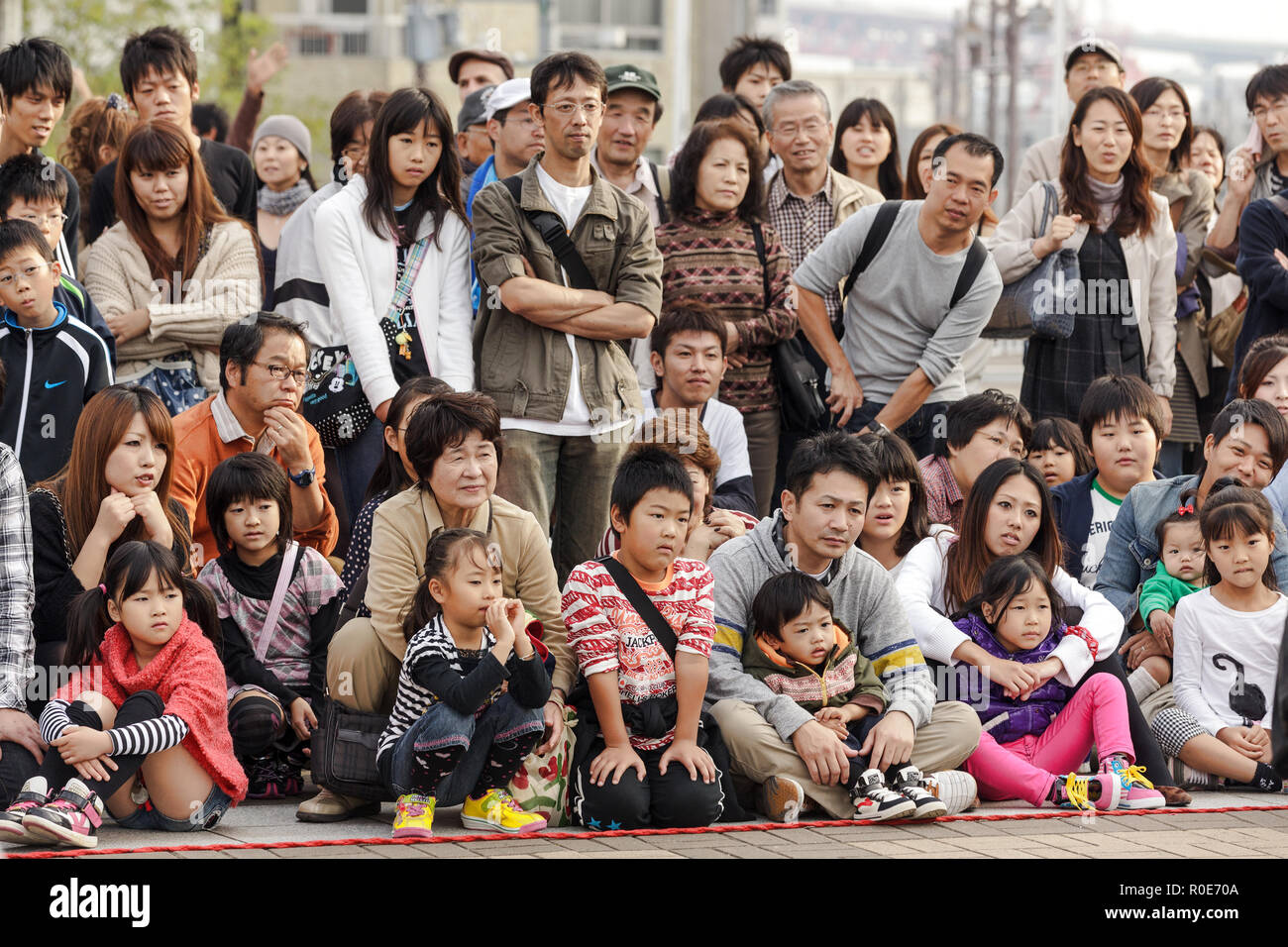 OSAKA, JAPAN, NOVEMBER 13, 2011: Japanese public crowd is watching a ...