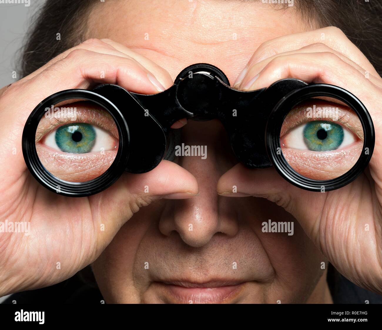 Man holding binoculars hi-res stock photography and images - Alamy