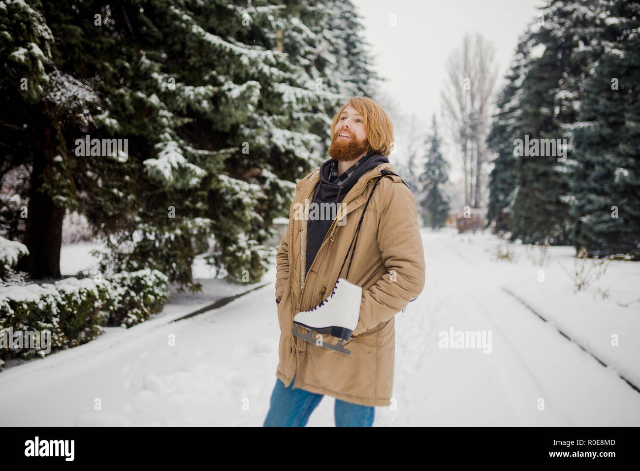 Winter sports theme. Portrait. Handsome young Caucasian guy with long ...