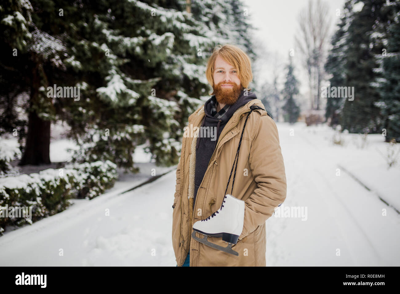 Winter sports theme. Portrait. Handsome young Caucasian guy with long ...
